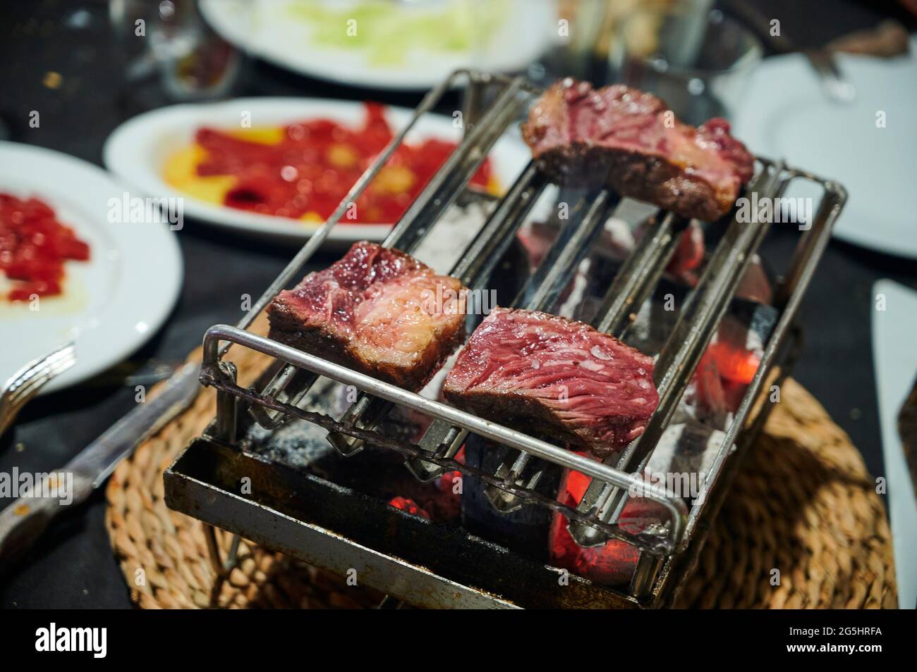 detail of red meat being made on the grill Stock Photo - Alamy