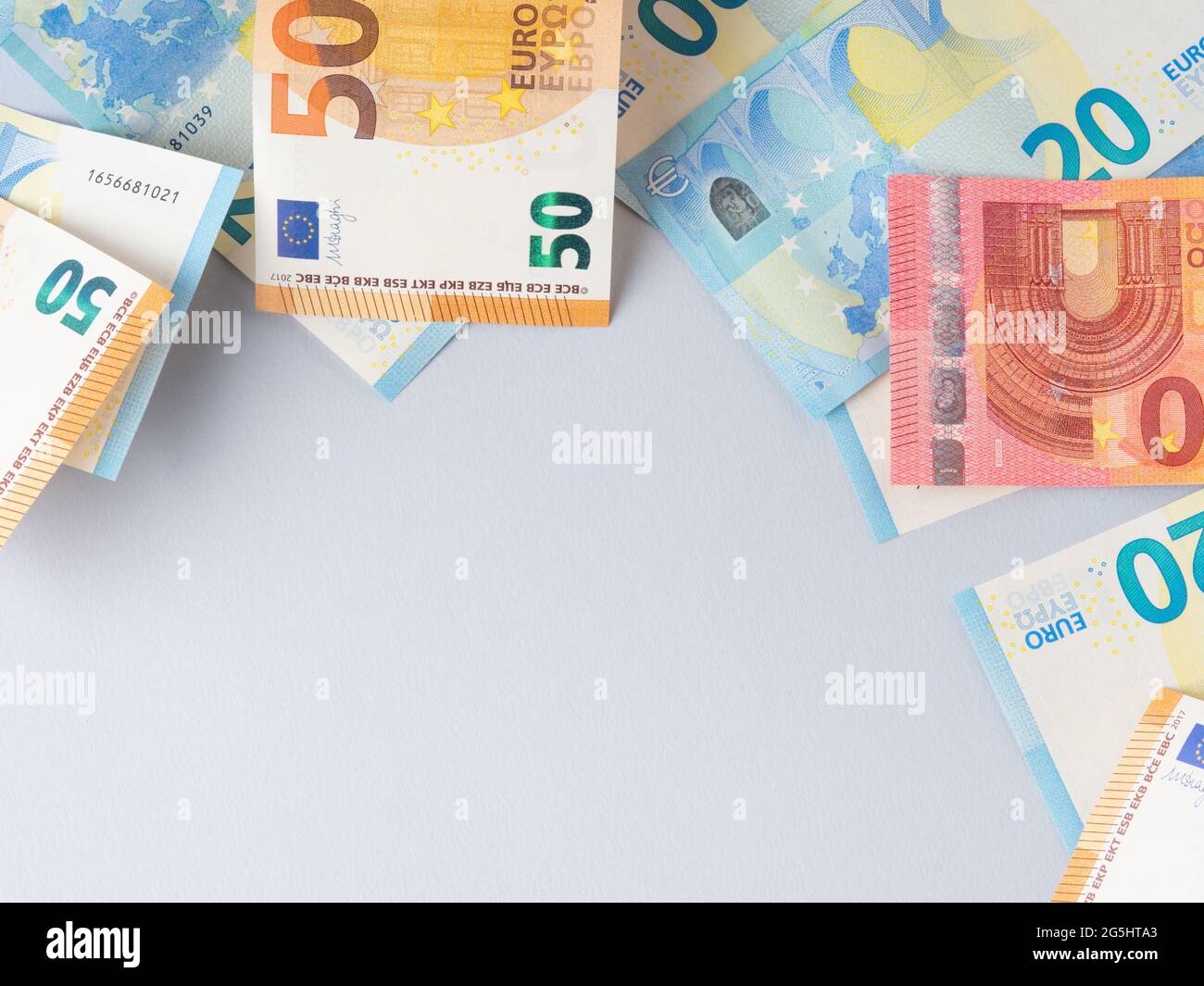 Euro money currency banknotes frame on blue background Stock Photo - Alamy