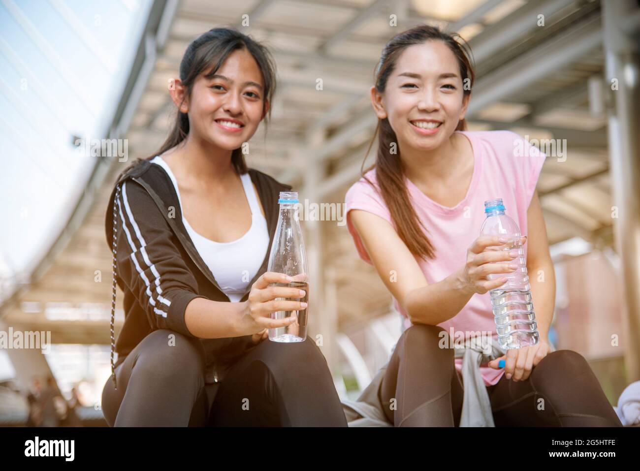 Woman drinking water exercising asian hi-res stock photography and ...