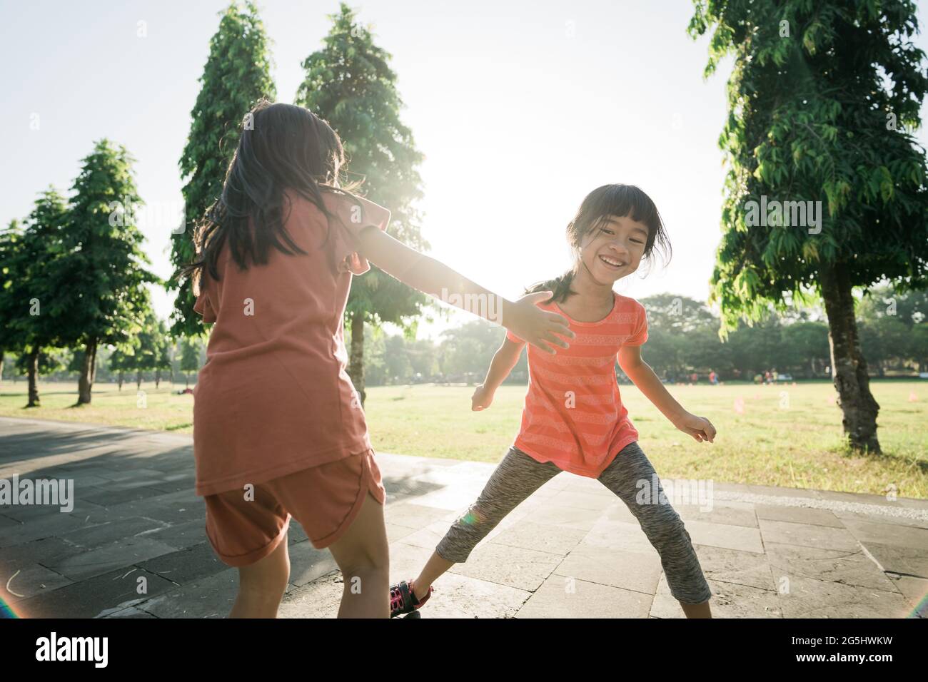 kid catch and play together outdoor with friend Stock Photo - Alamy