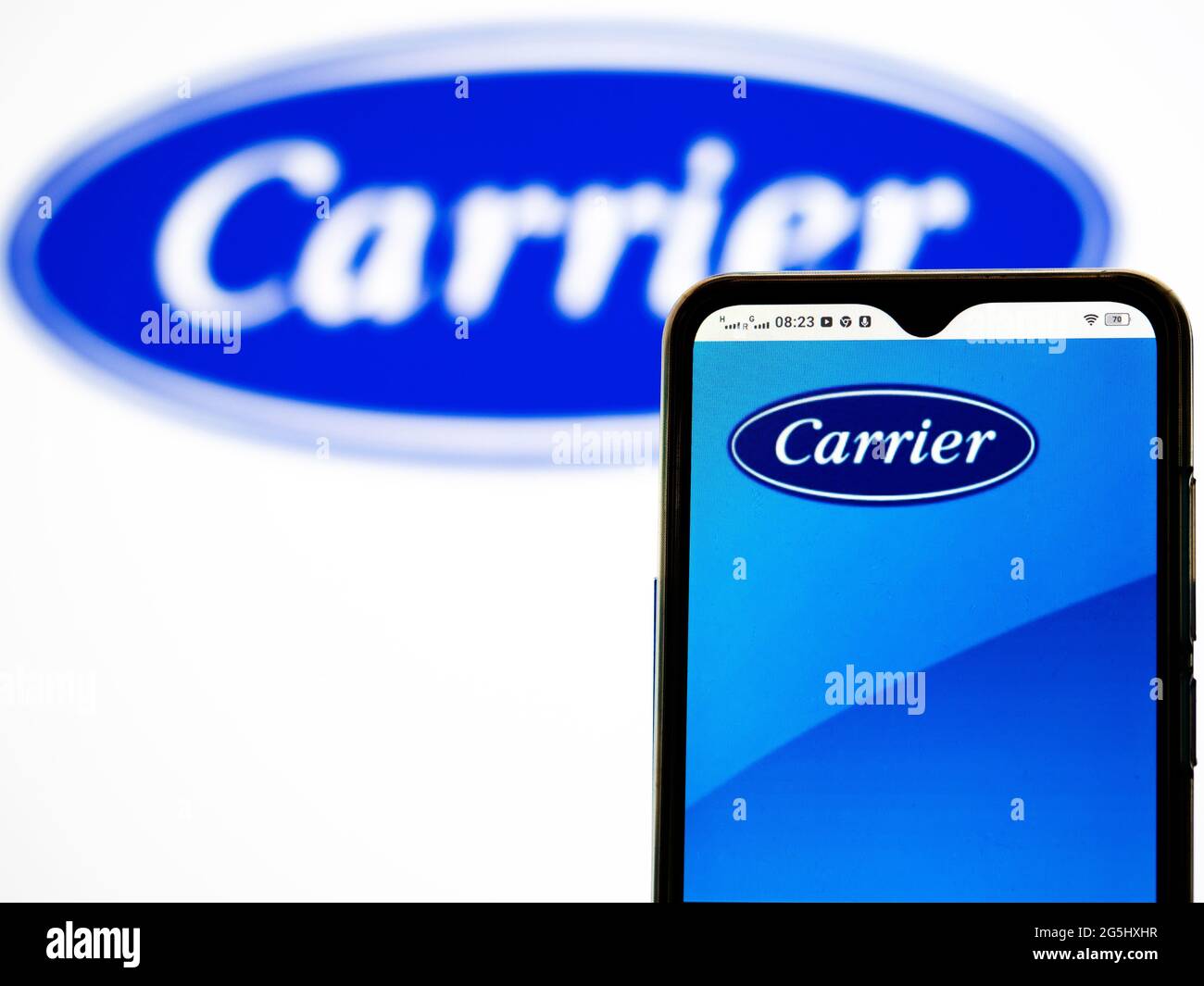 In this photo illustration a Carrier Corporation logo seen displayed on ...