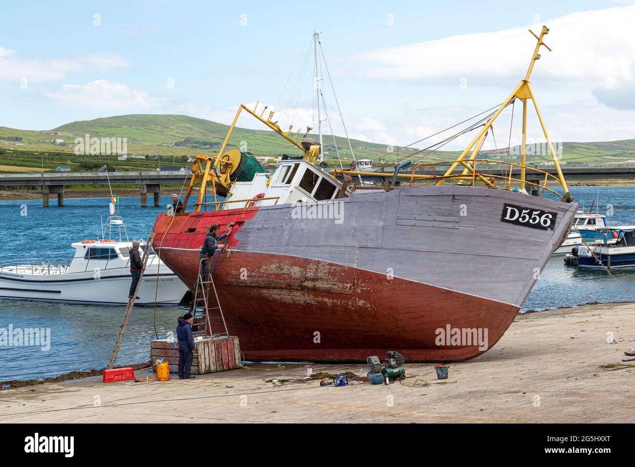 Fishermen painting trawler fishing boat hi-res stock photography and ...