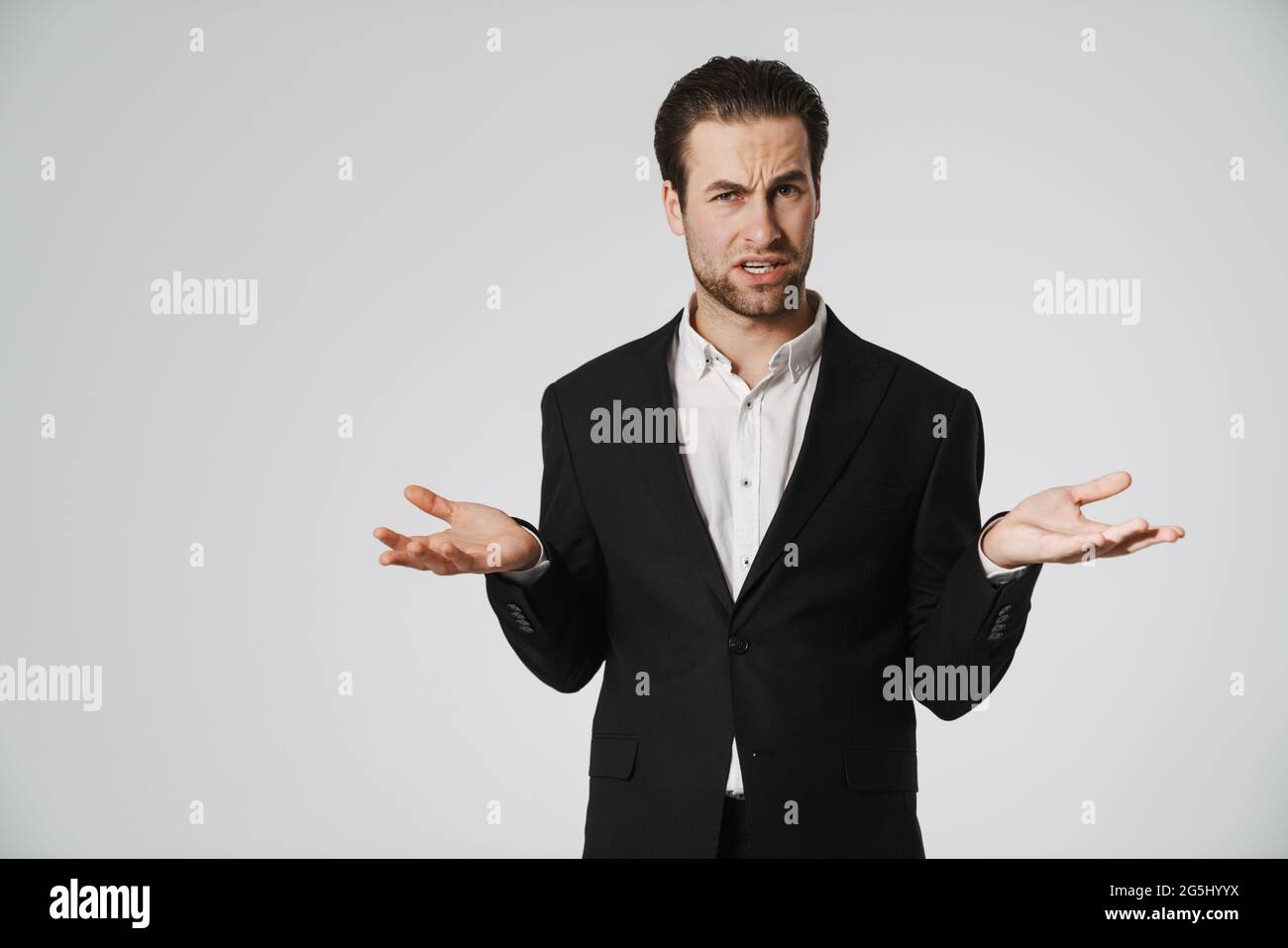 Unshaven displeased man gesturing hi-res stock photography and images ...