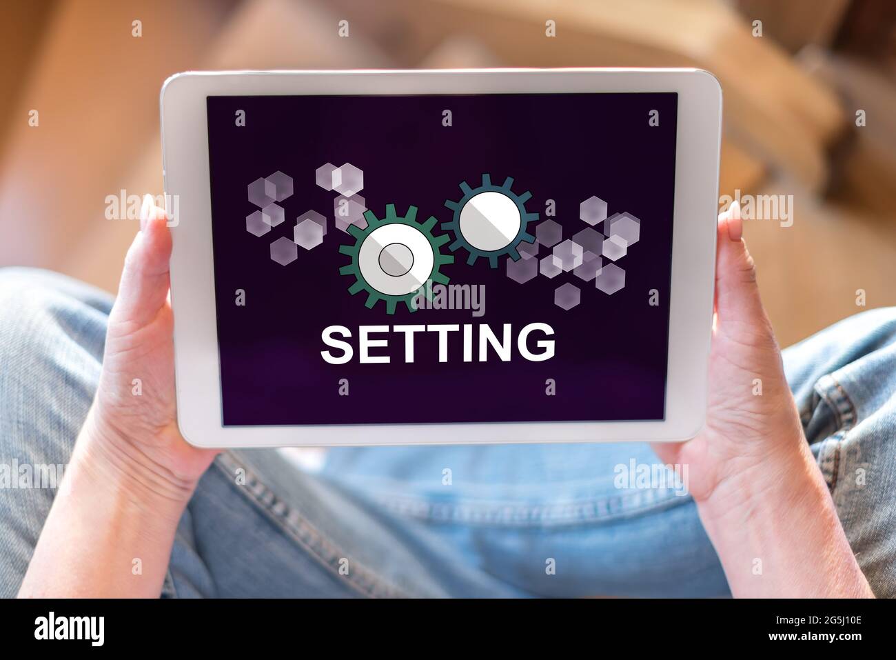 Tablet screen displaying a setting concept Stock Photo - Alamy