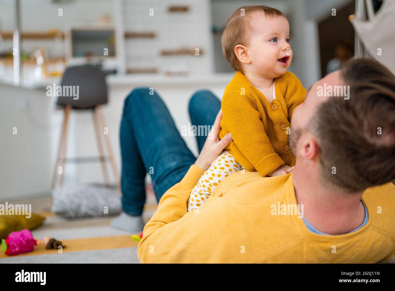 Young father is having fun with his little baby Stock Photo - Alamy
