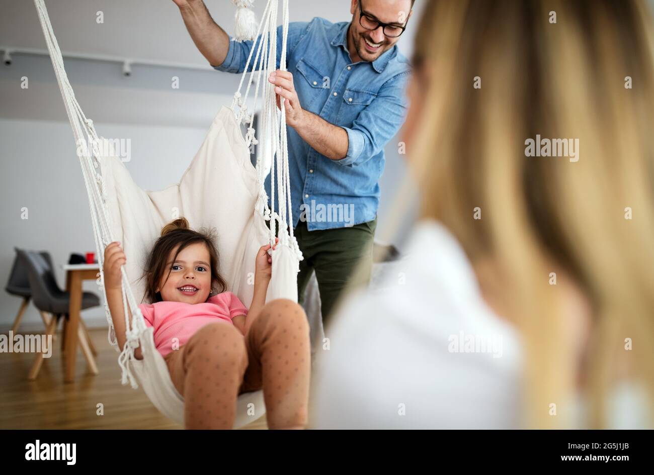 Happy family having fun times at home Stock Photo - Alamy