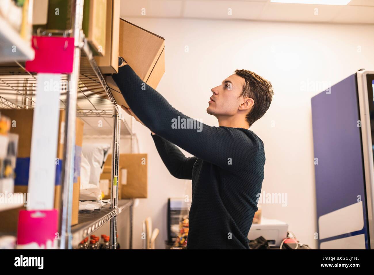 Removing from the box hi-res stock photography and images - Alamy