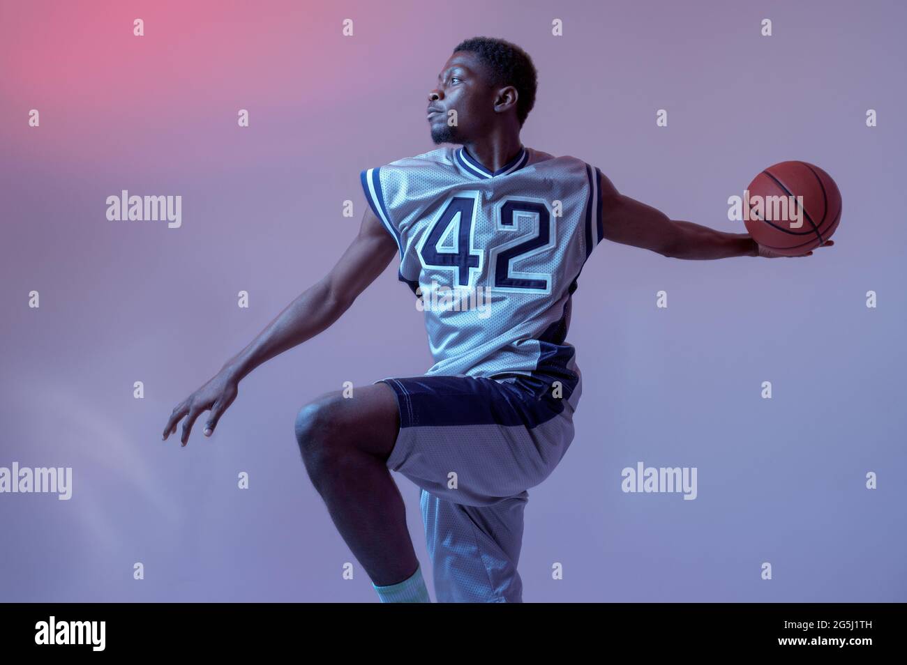 Basketball player with ball, jump in action Stock Photo - Alamy