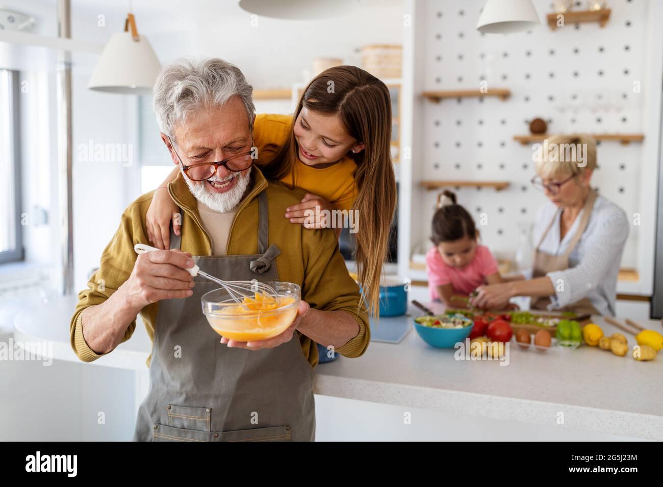 Happy grandparent playing, having fun with grandchildren Stock Photo - Alamy