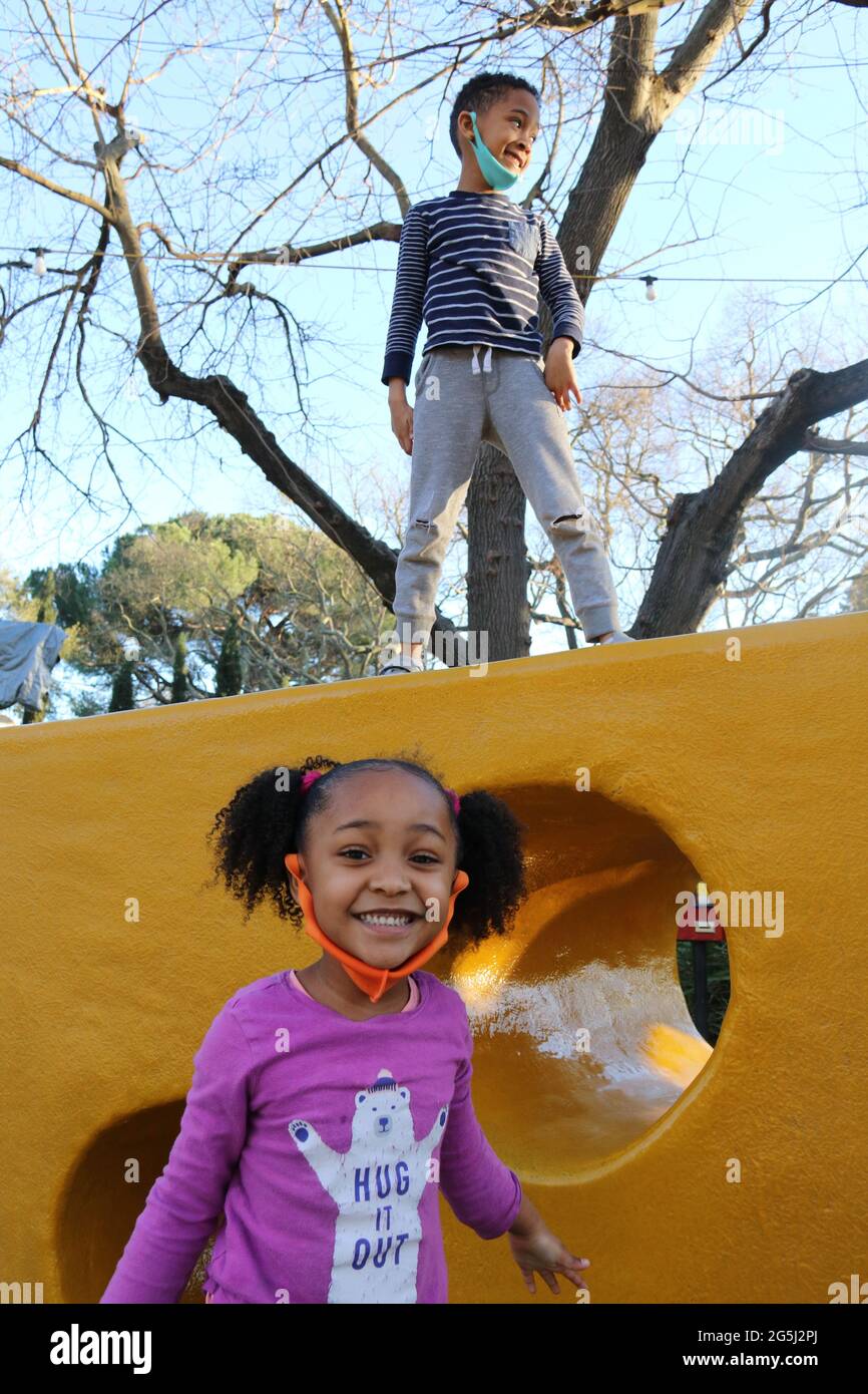 Happy African American children playing on a playground Stock Photo - Alamy