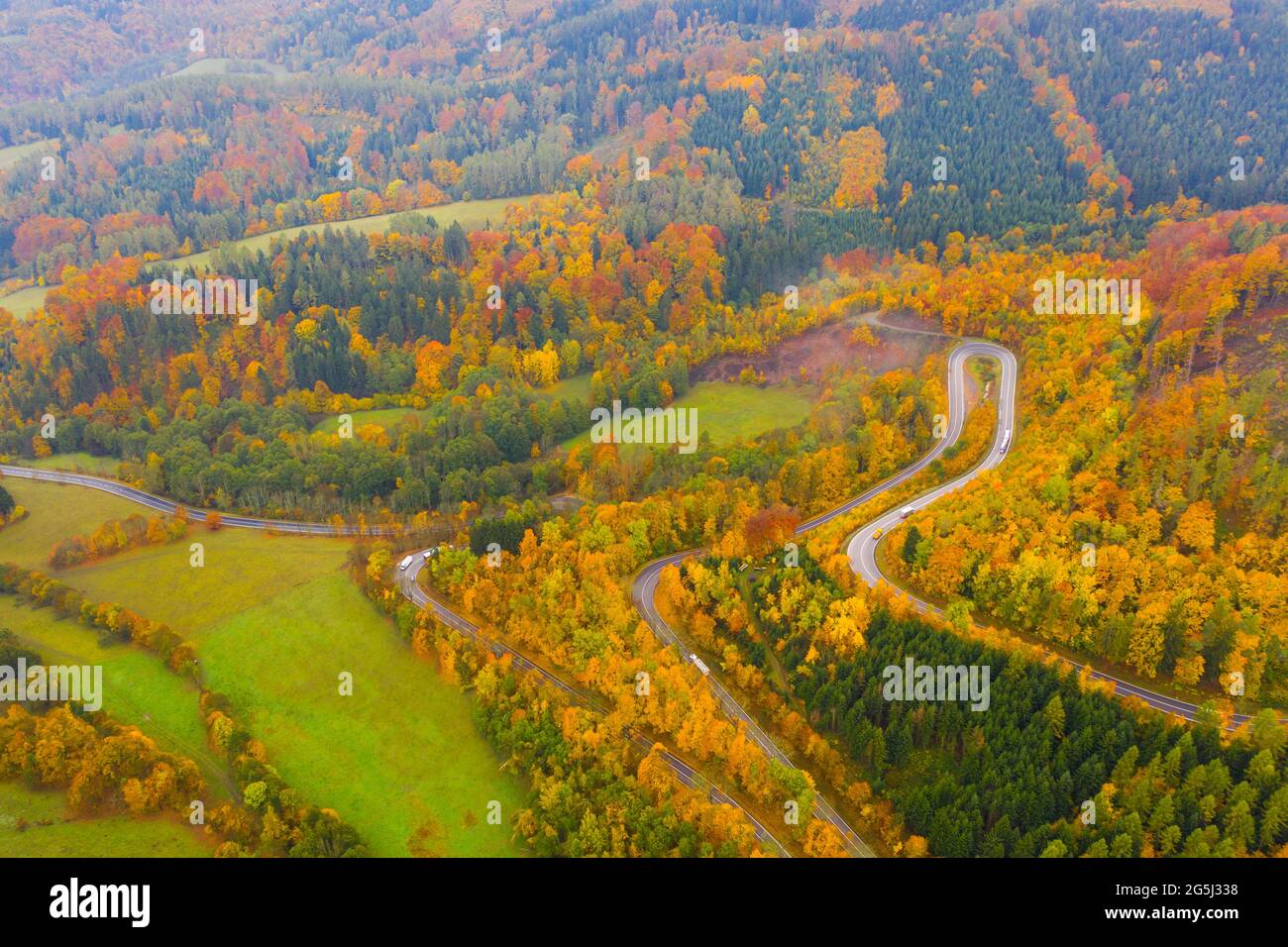 Autumn landscape with winding road Stock Photo - Alamy