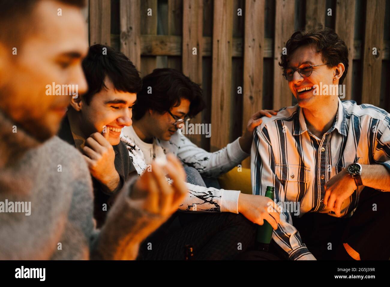 Male friends talking young hi-res stock photography and images - Alamy