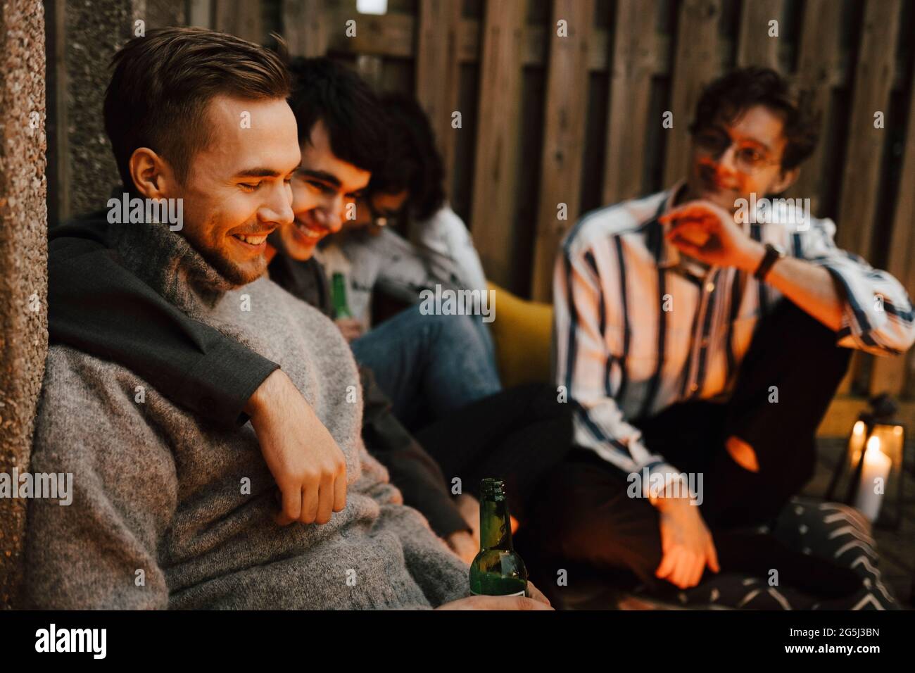 Four friends on balcony hi-res stock photography and images - Alamy