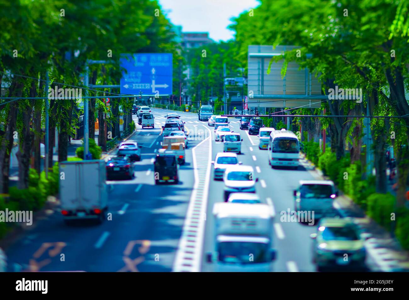 A miniature traffic jam at the avenue daytime in the downtown tiltshift ...