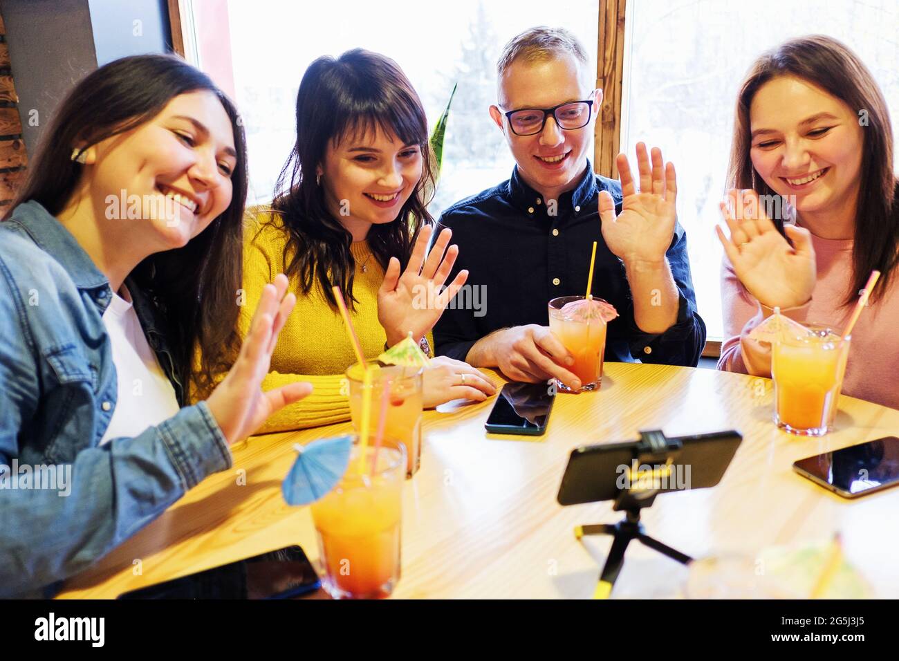A group of friends video call and greet the other person - Millennials ...