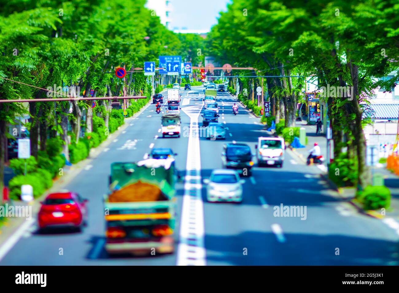 A miniature traffic jam at the avenue daytime in the downtown tiltshift ...
