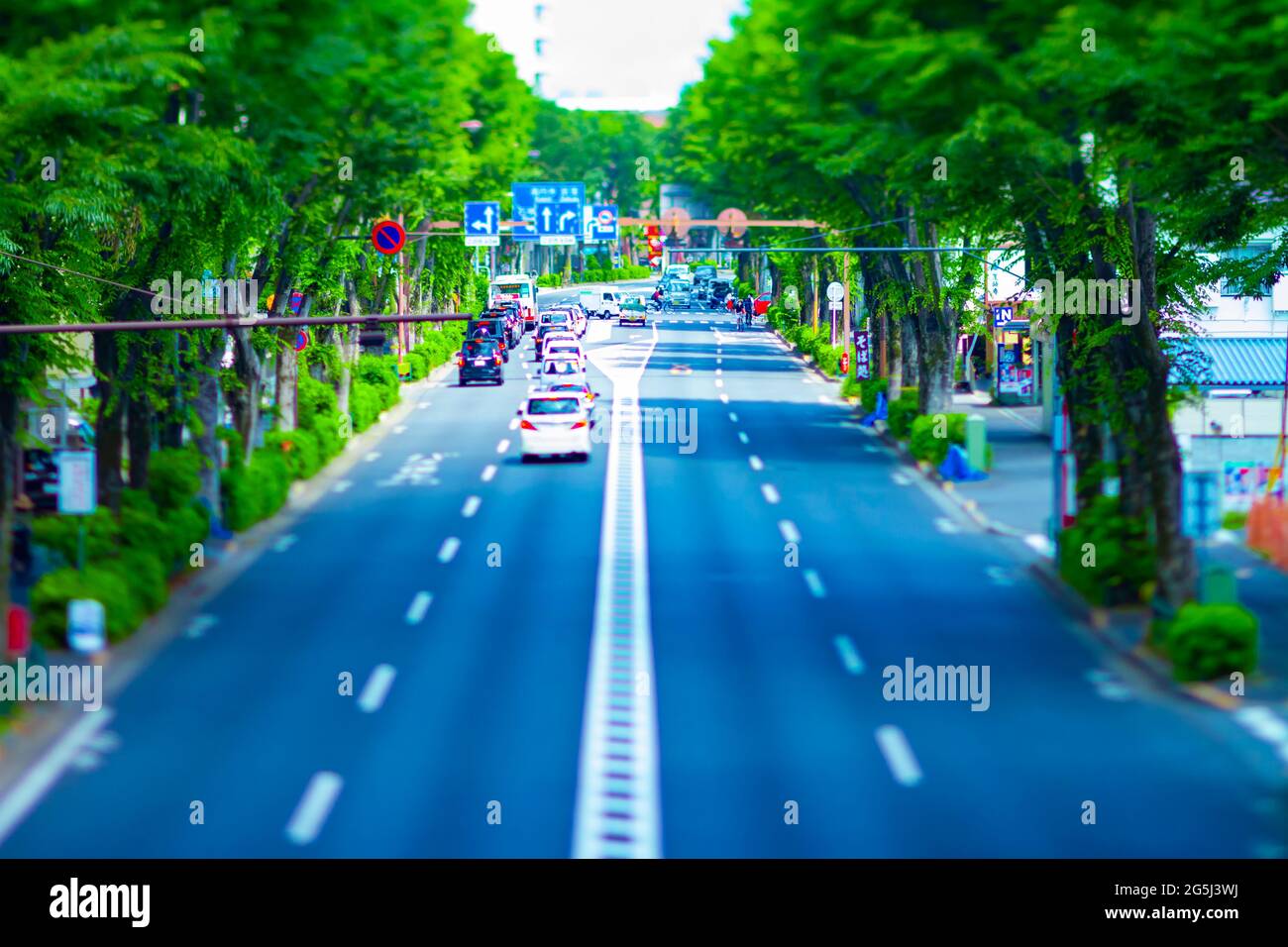 A miniature traffic jam at the avenue daytime in the downtown tiltshift ...