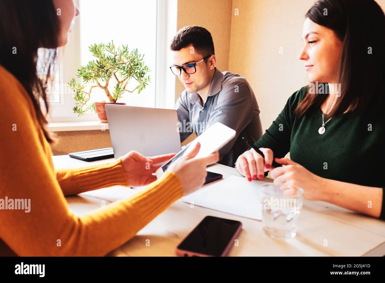 A group of young colleagues are working on a startup - Colleagues and ...