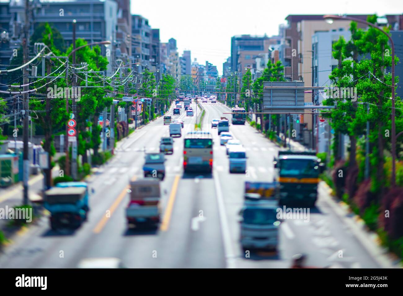 A miniature traffic jam at the avenue daytime in the downtown tiltshift ...