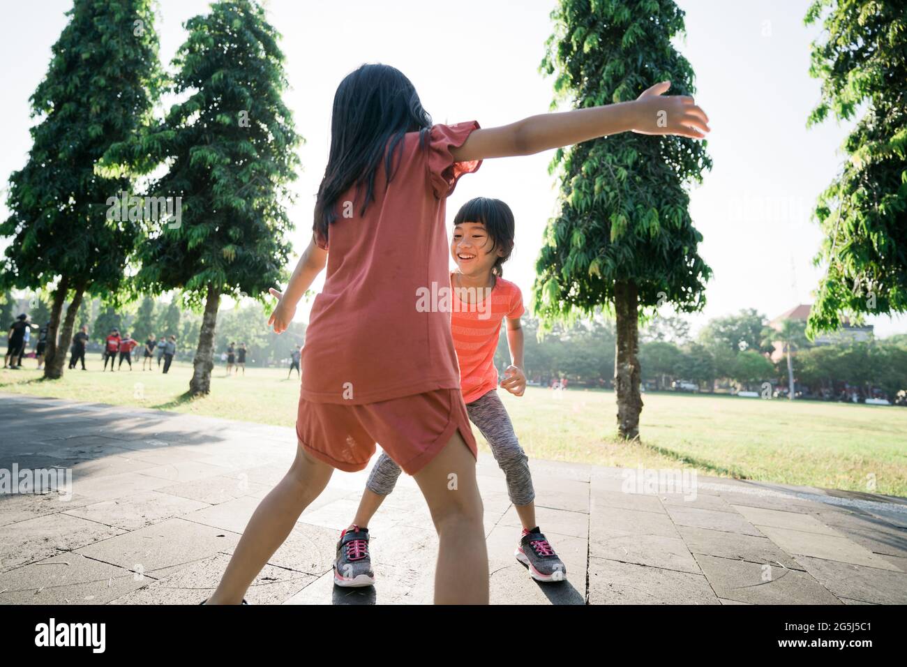 kid catch and play together outdoor with friend Stock Photo - Alamy