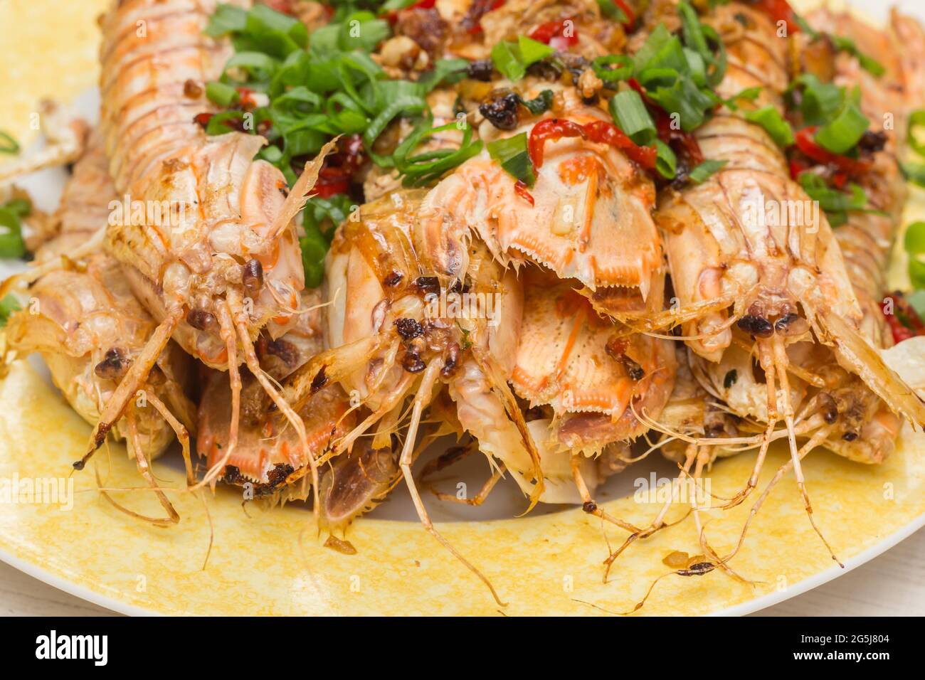 Asian style cooked mantis (Stomatopoda) shrimp with spring onion and ...