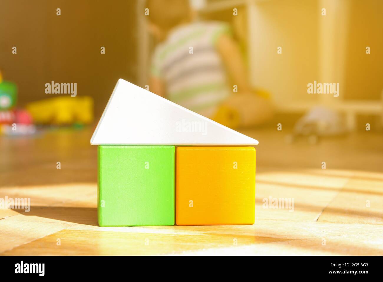 Children's toy house of wooden cubes. Constructor Stock Photo - Alamy
