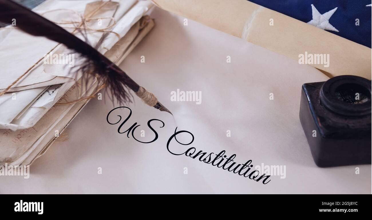 Composition of text us constitution, with quill pen and inkwell on ...