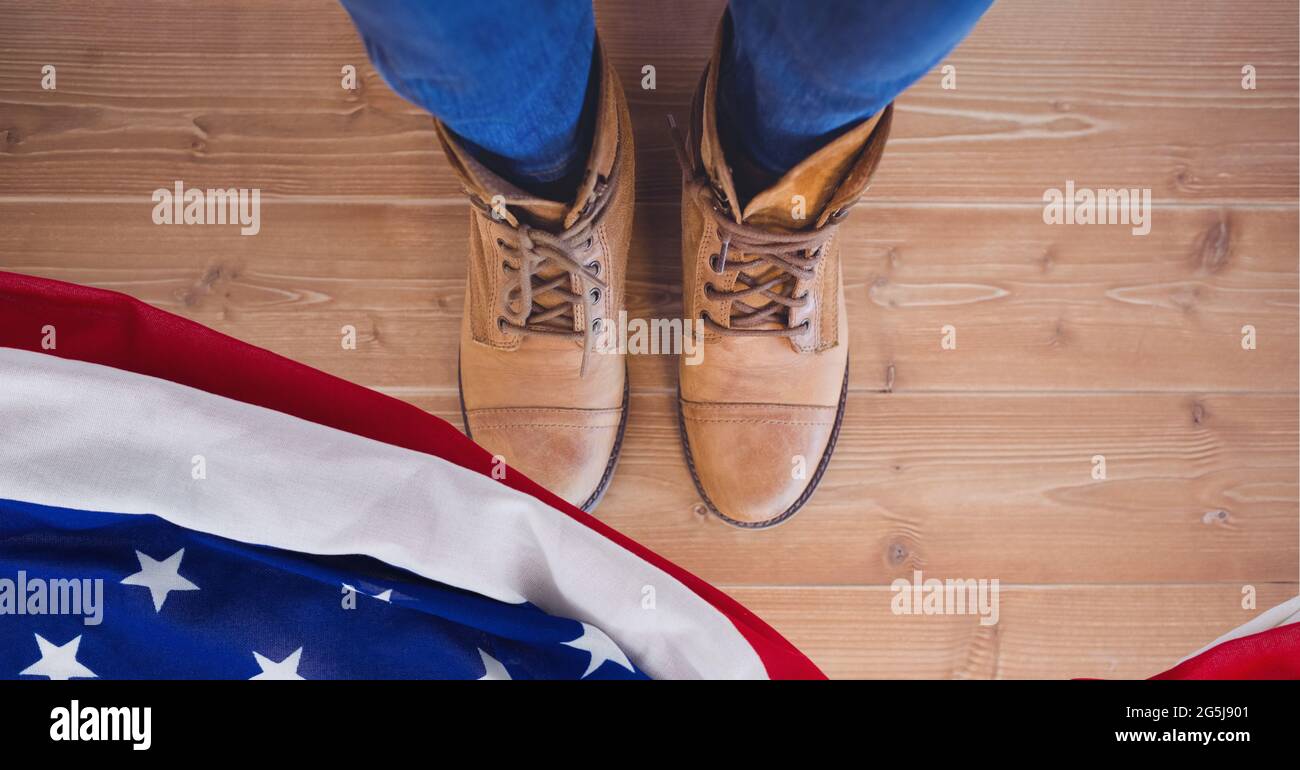 Composition of person's legs in wooden floor with american flag Stock ...