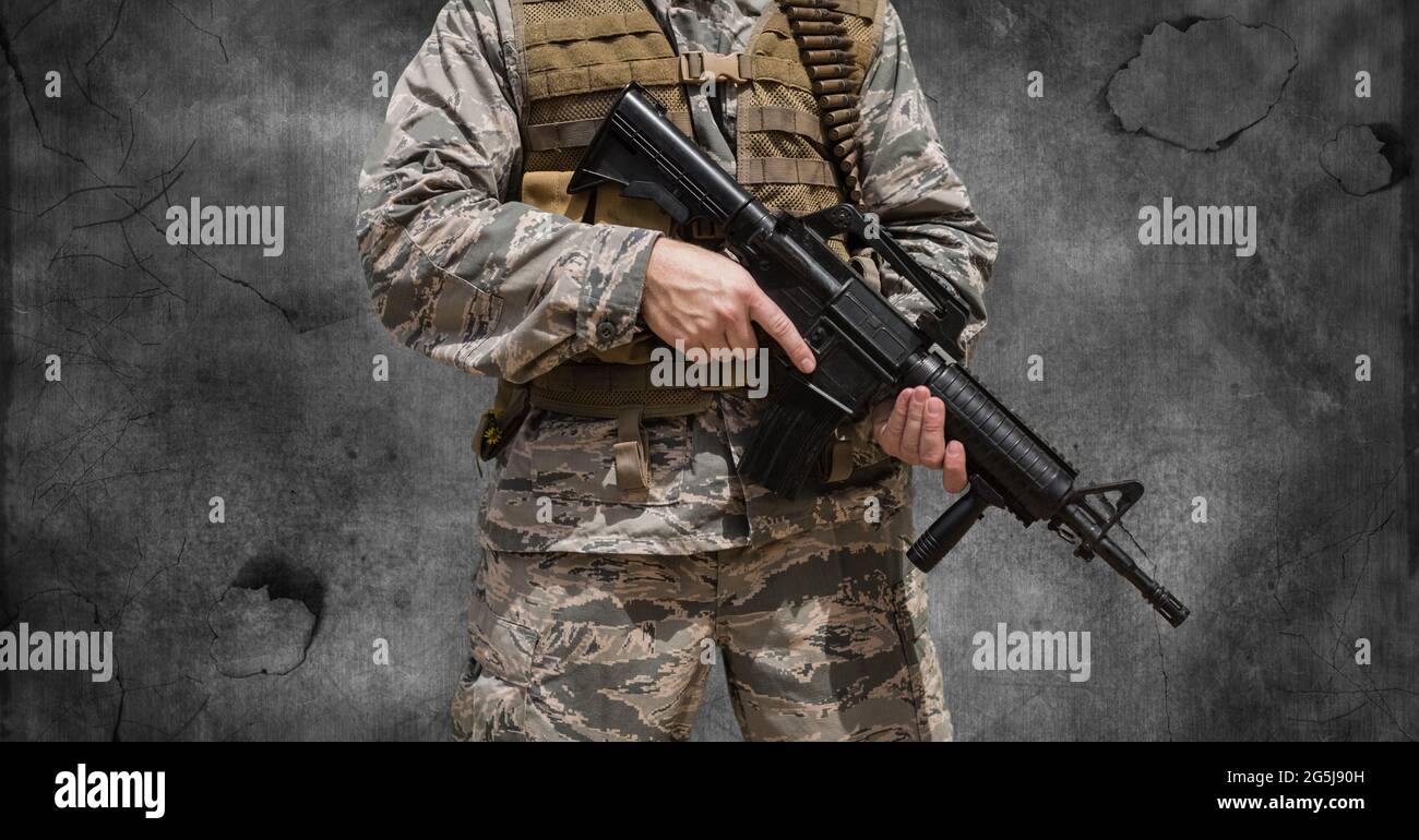 Soldier holding gun rifle hi-res stock photography and images - Alamy