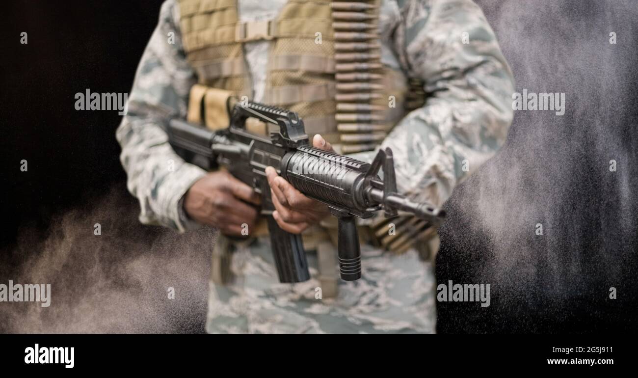 Soldier holding gun rifle hi-res stock photography and images - Alamy