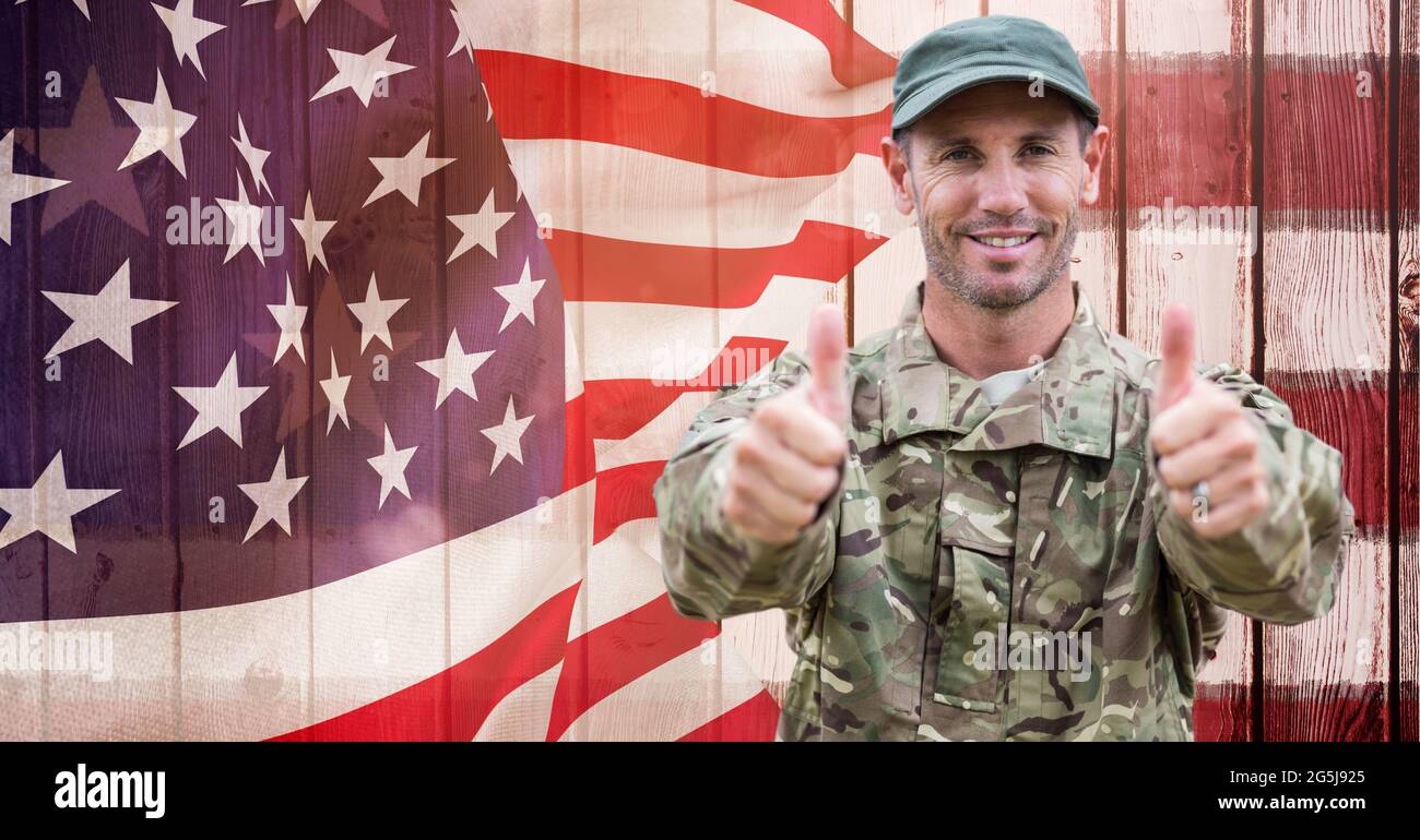 Composition of smiling male soldier giving thumbs up, against waving ...