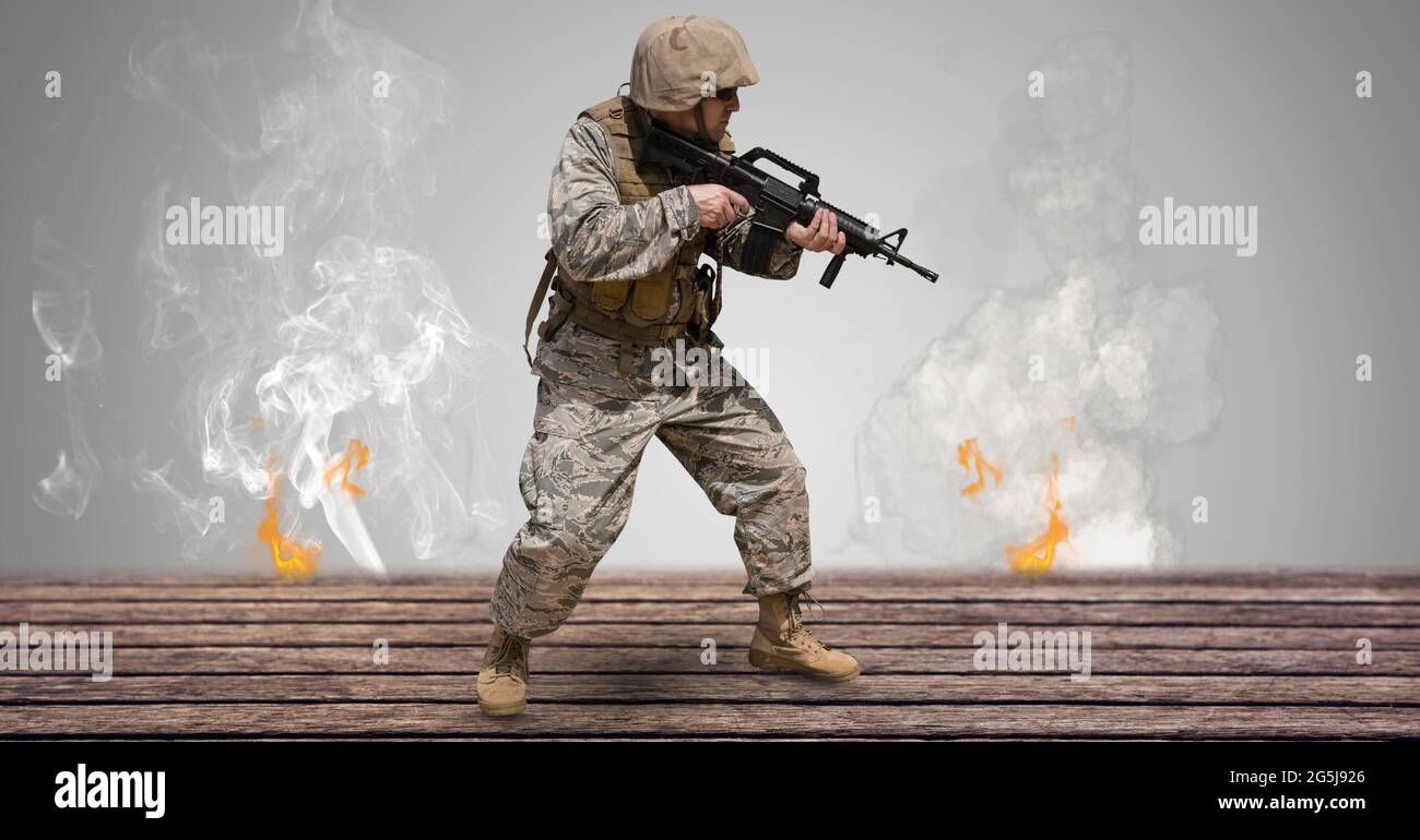 Soldier holding gun rifle hi-res stock photography and images - Alamy