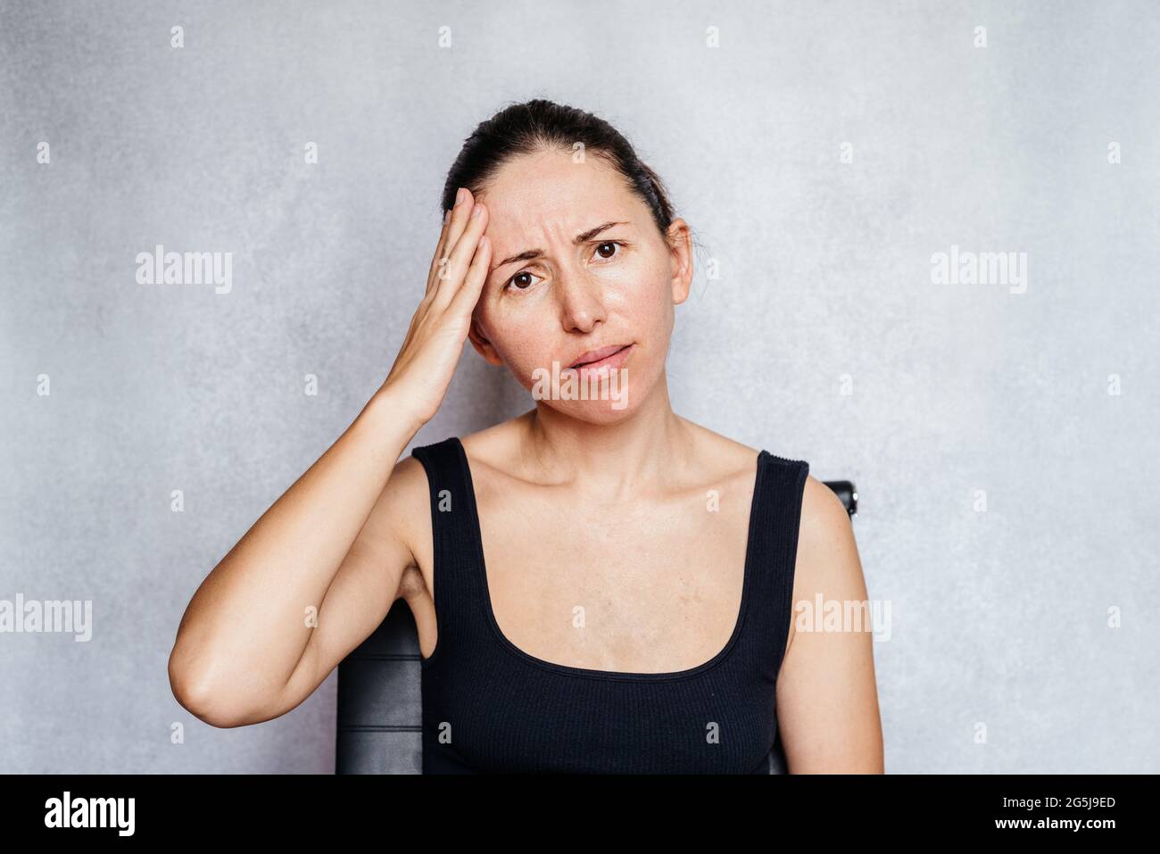 A woman having headache, exercises to beat headache Stock Photo - Alamy
