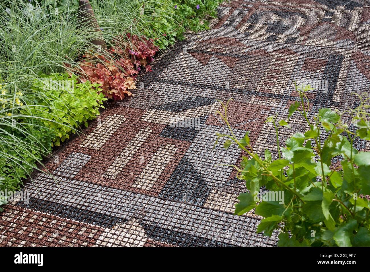 Paving constructed from steel grids to form an abstract urban design ...
