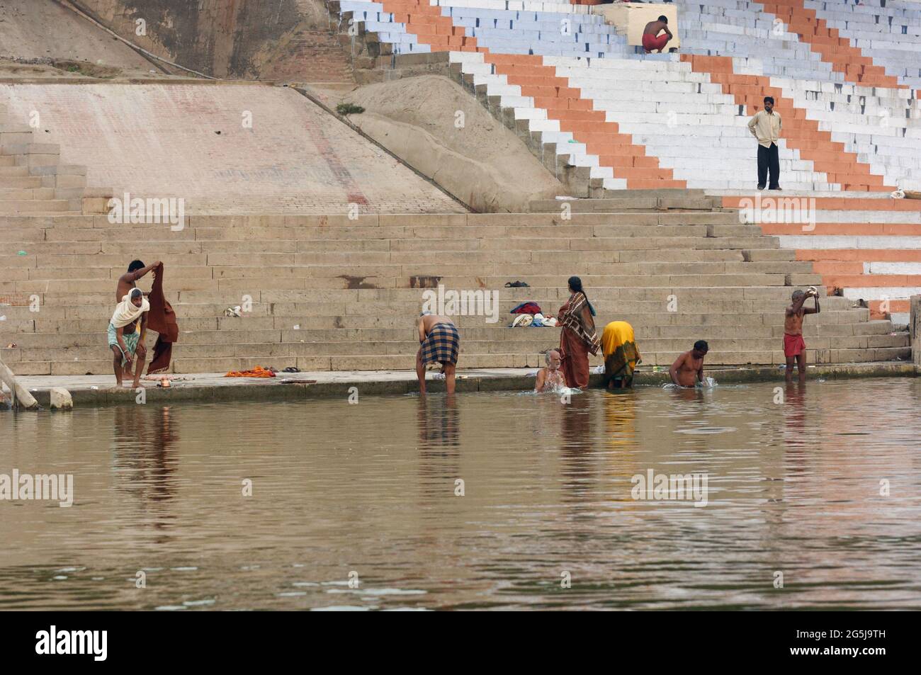 Morning bathers along the holy River Ganges at Varanasi, Utter Pradesh ...