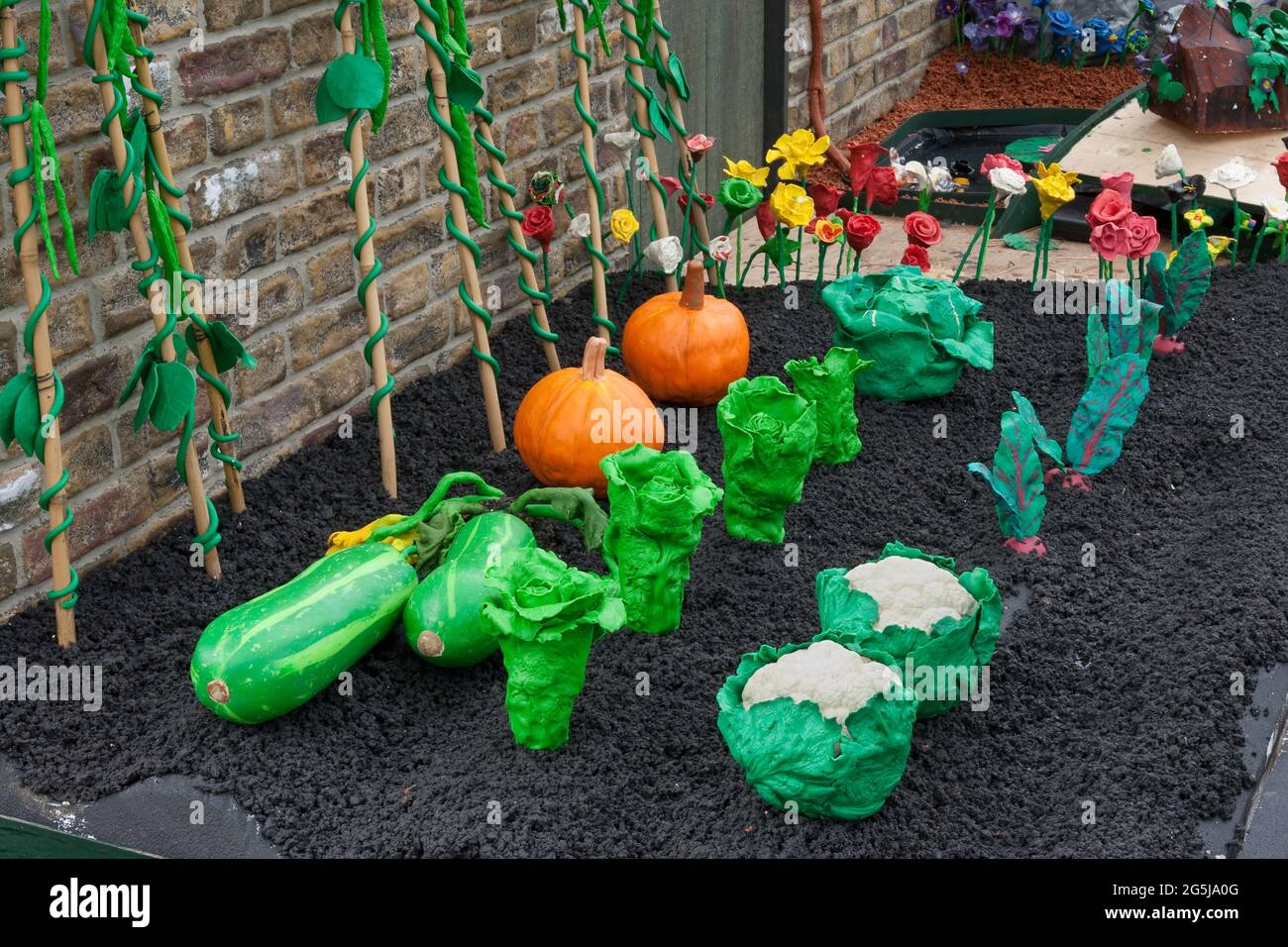Paradise in Plasticine vegetable patch and bean canes Stock Photo - Alamy