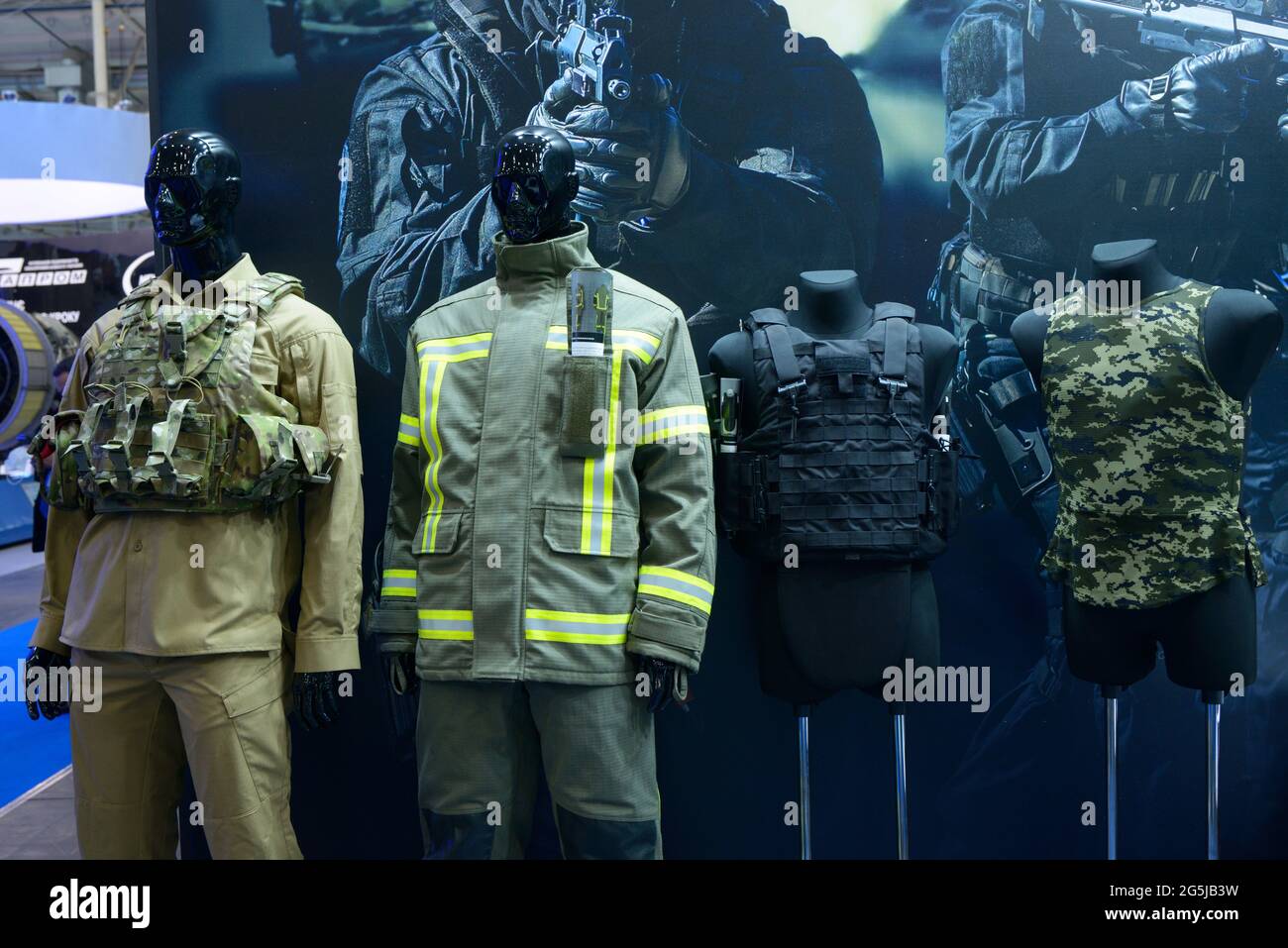 Military bandoliers, uniforms and bulletproofs presented on stand Stock ...