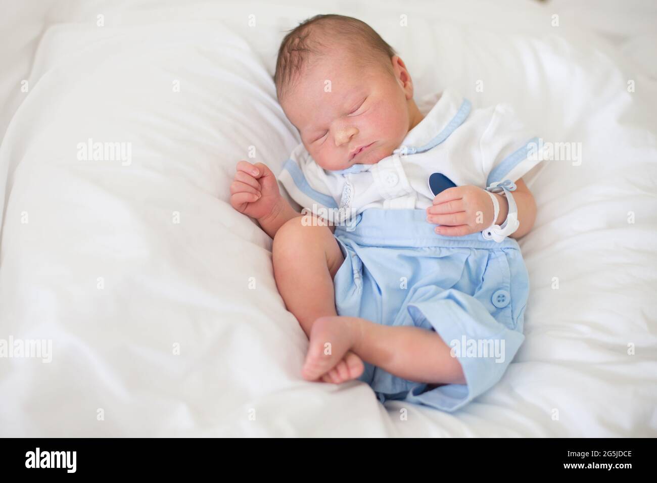Beautiful newborn baby boy, laying in crib in prenatal hospital Stock Photo - Alamy