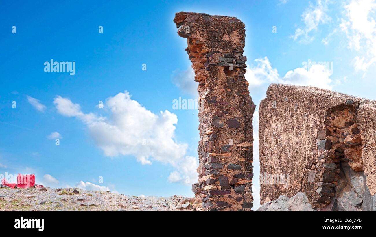 Ancient fort shot. Old rough column of the fort in ruins stage. 16 th ...