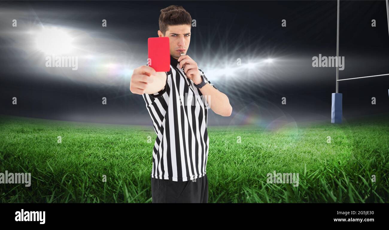 Composition of male referee holding red card at stadium Stock Photo - Alamy