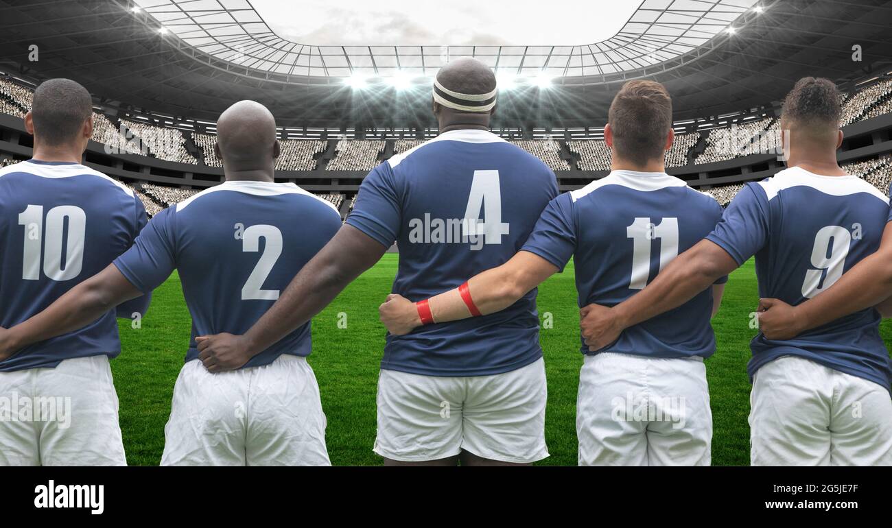 Composition of male rugby team embracing at stadium Stock Photo - Alamy