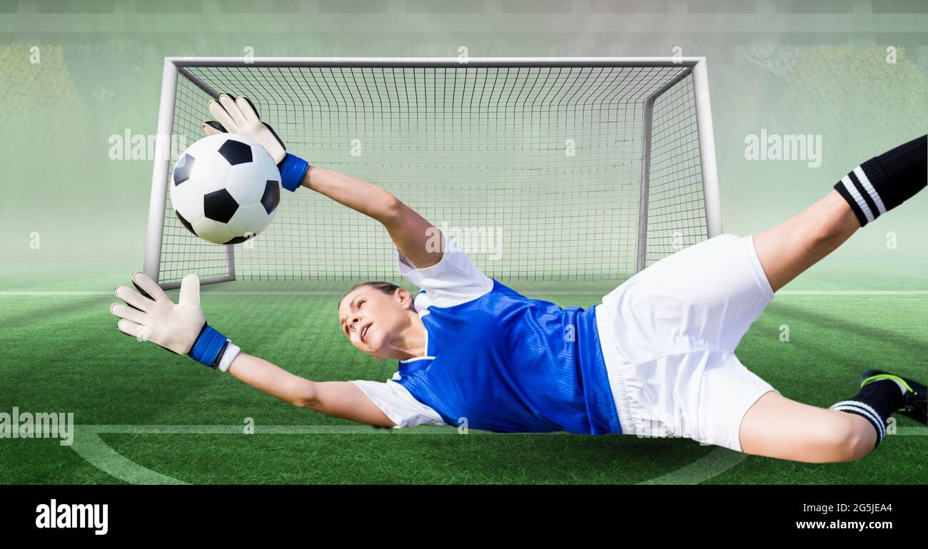 Composition of female goalkeeper catching ball at football stadium ...