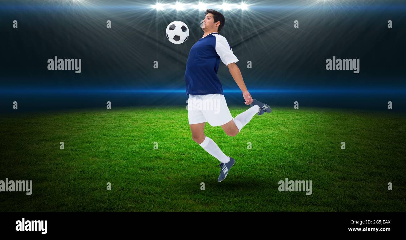 Composition of male football player with ball at stadium Stock Photo ...