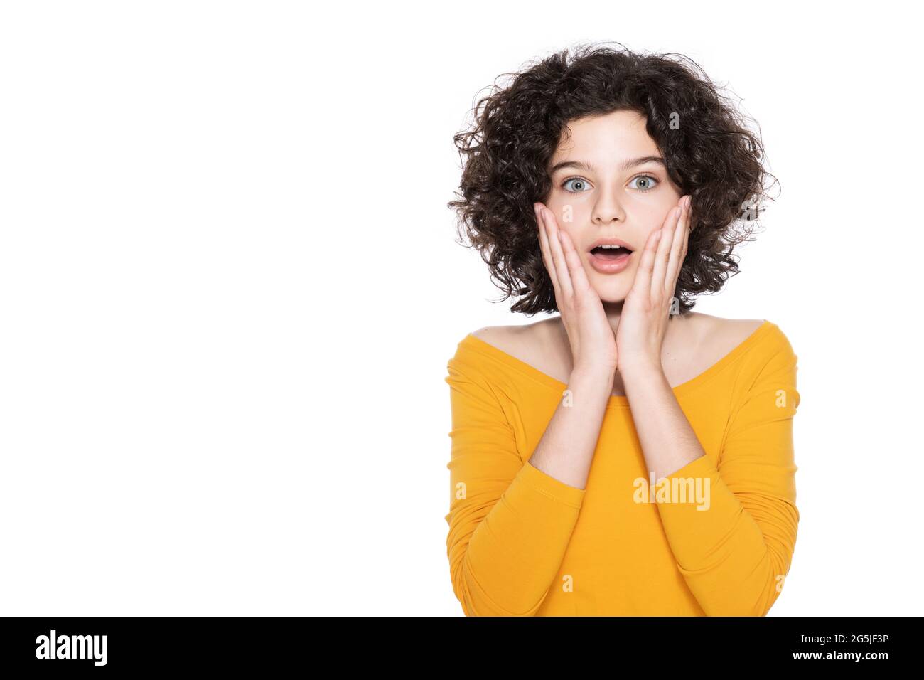 Shocked teenager screaming in disbelief, isolated over white background ...