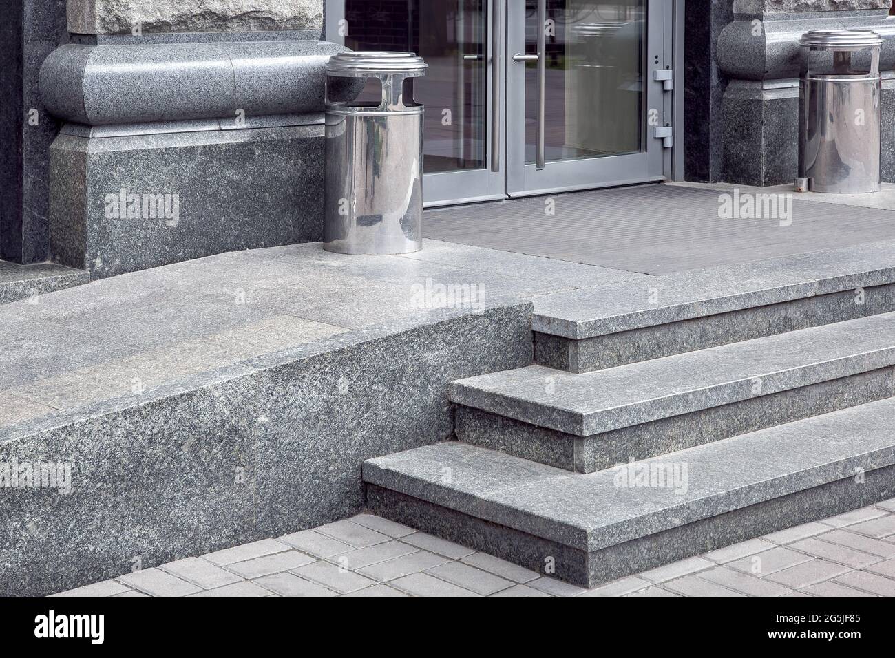 granite gray porch step with a foot mat at the entrance to the central ...