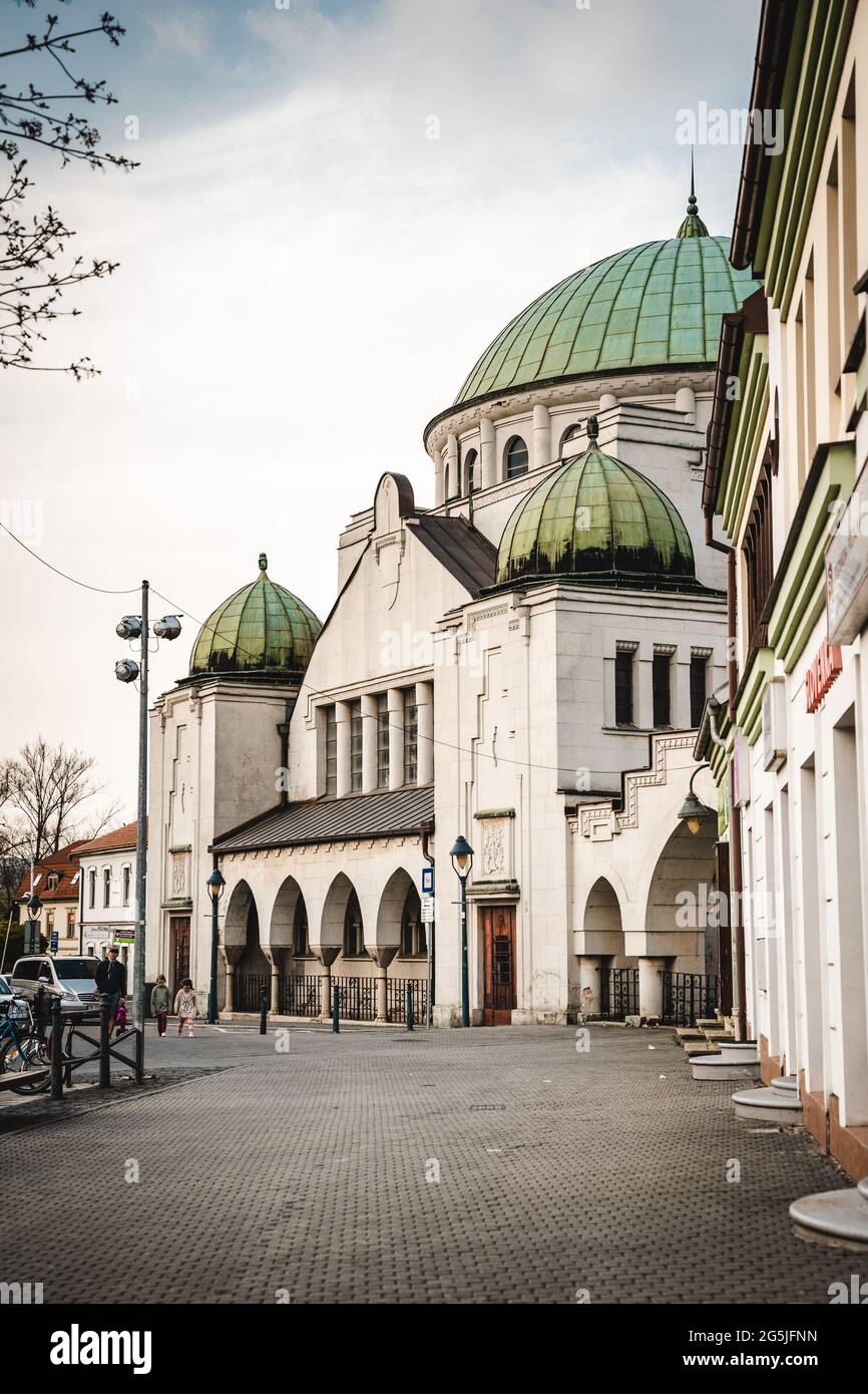 old historical synagog in Trencin square at cloudy day Stock Photo - Alamy