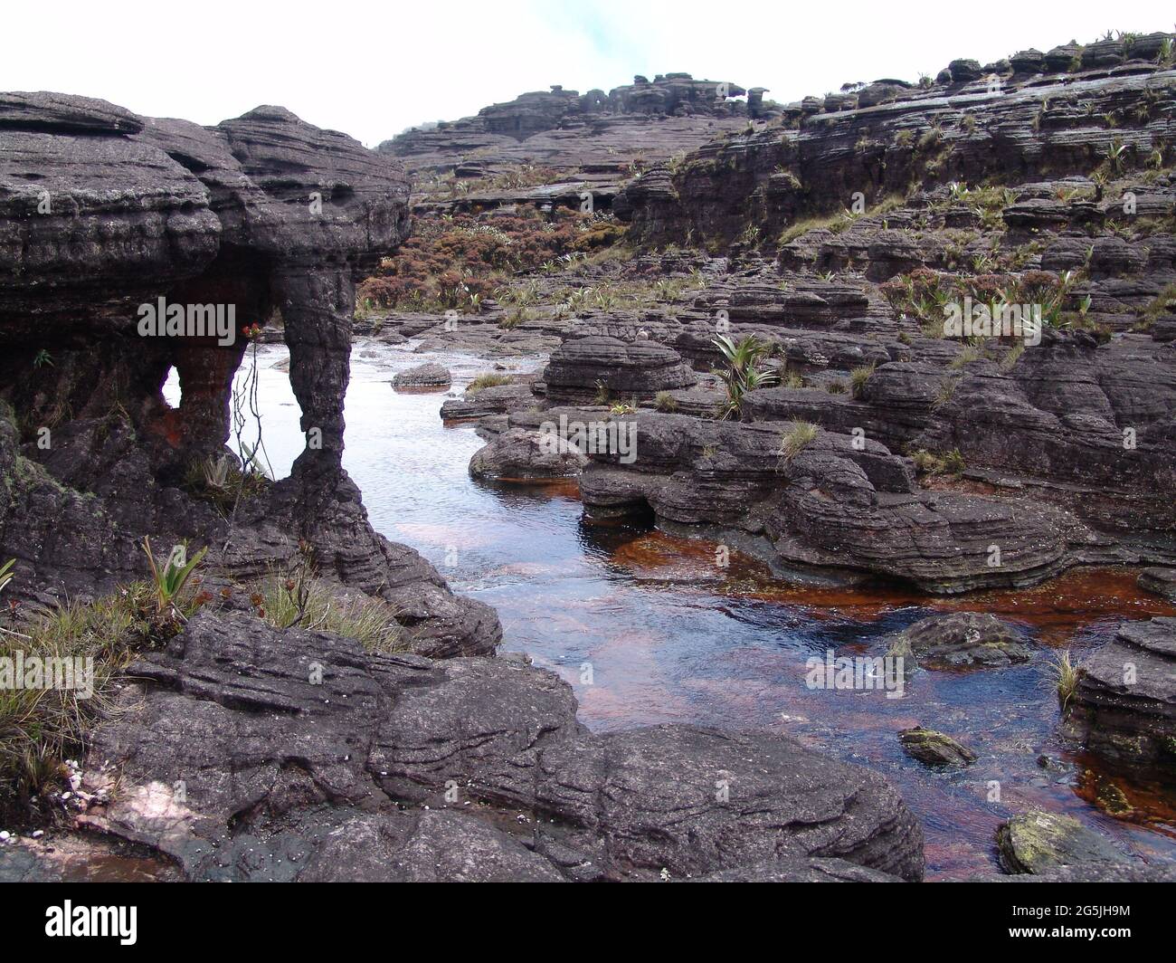 Many stone formations and rocks in a stream on the climbing path of ...