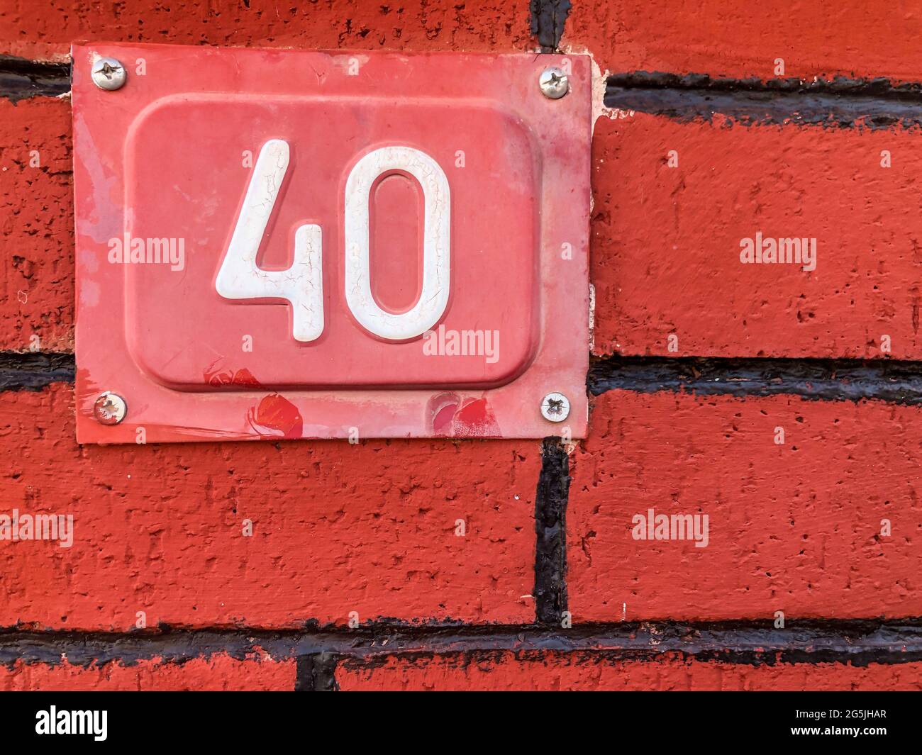 number forty on red brick wall Stock Photo - Alamy