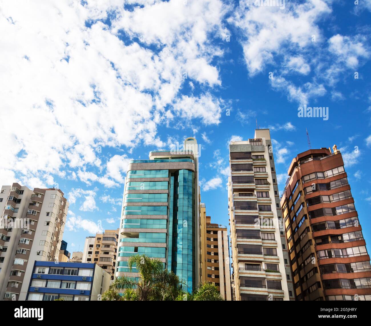 High-rise buildings of an urban area against the blue sky Stock Photo ...