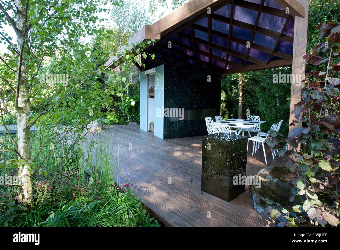 Pavilion, table and chairs, decking, birch Stock Photo - Alamy